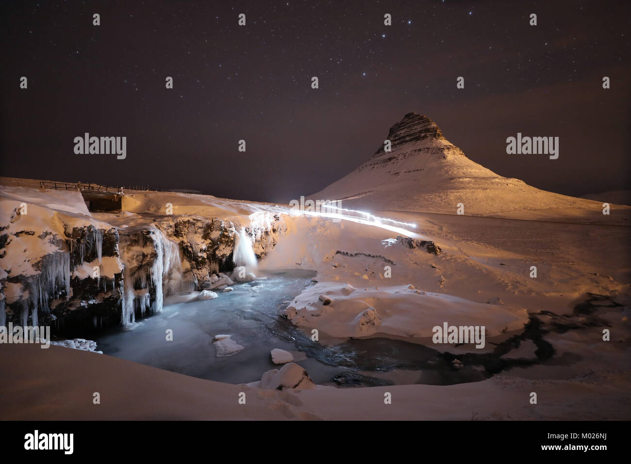 The frozen five meter high Kirjufell waterfall on the west coast of ...