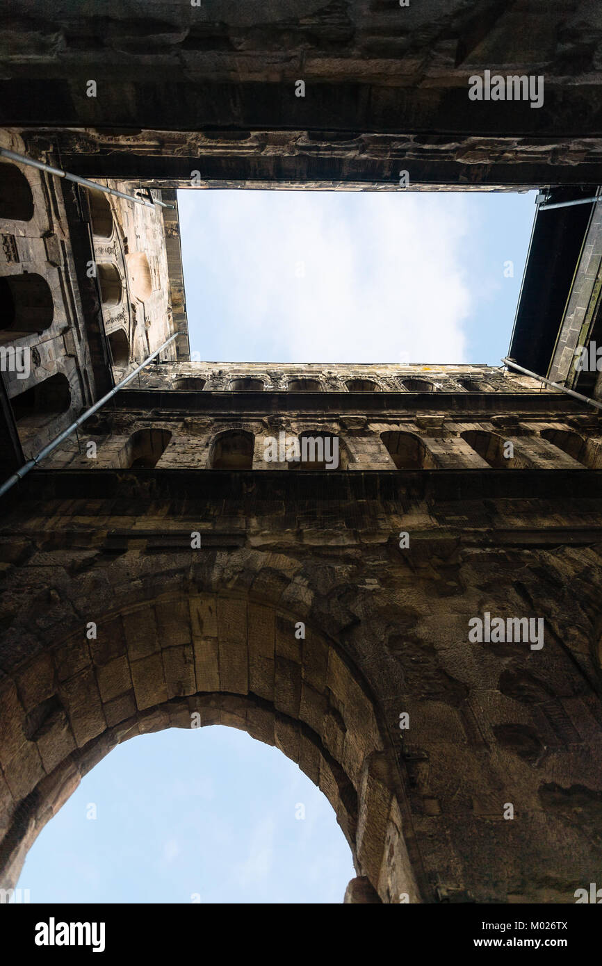 travel to Germany - bottom view of ancient roman city gate Porta Nigra ...