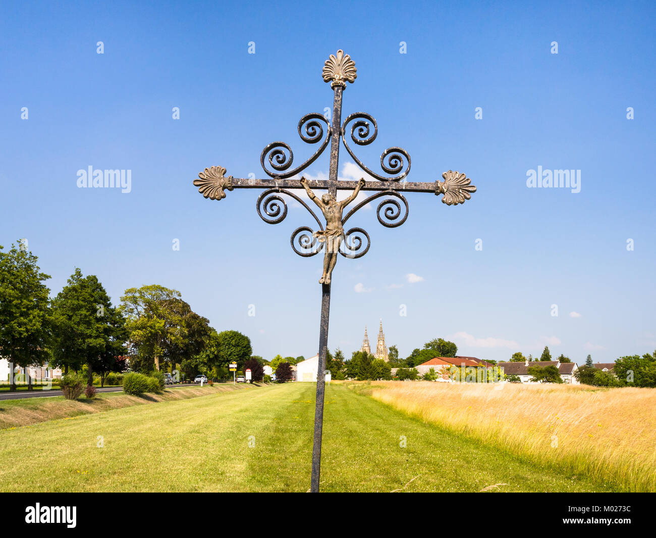 travel to France - old Christian cross in cereal field near commune L ...