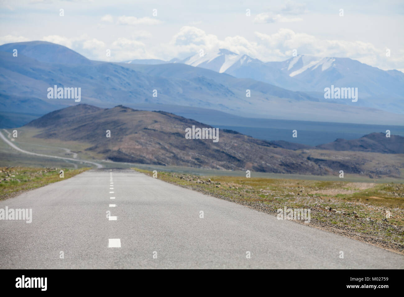 Color image of a straight and empty road in a beautiful scenery Stock ...