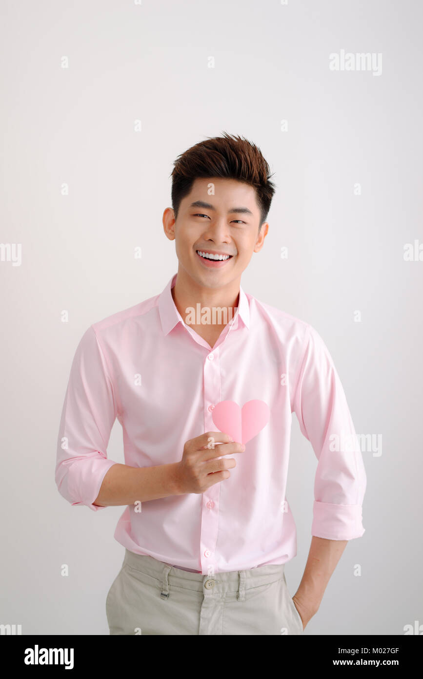 Handsome young asian man holding paper heart shaped valentine Stock ...