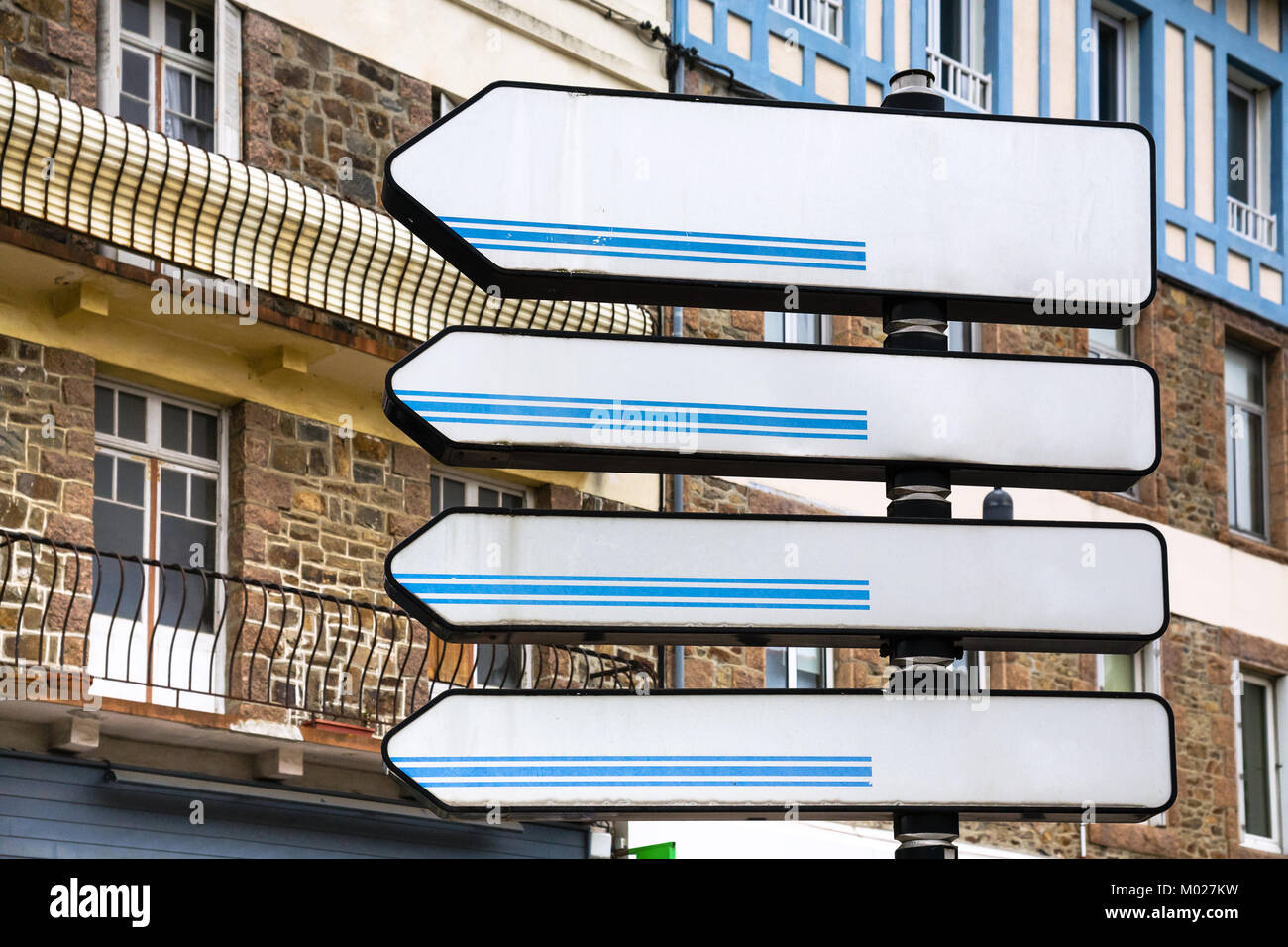 travel to France- four empty arrow road signs in Perros-Guirec town in ...