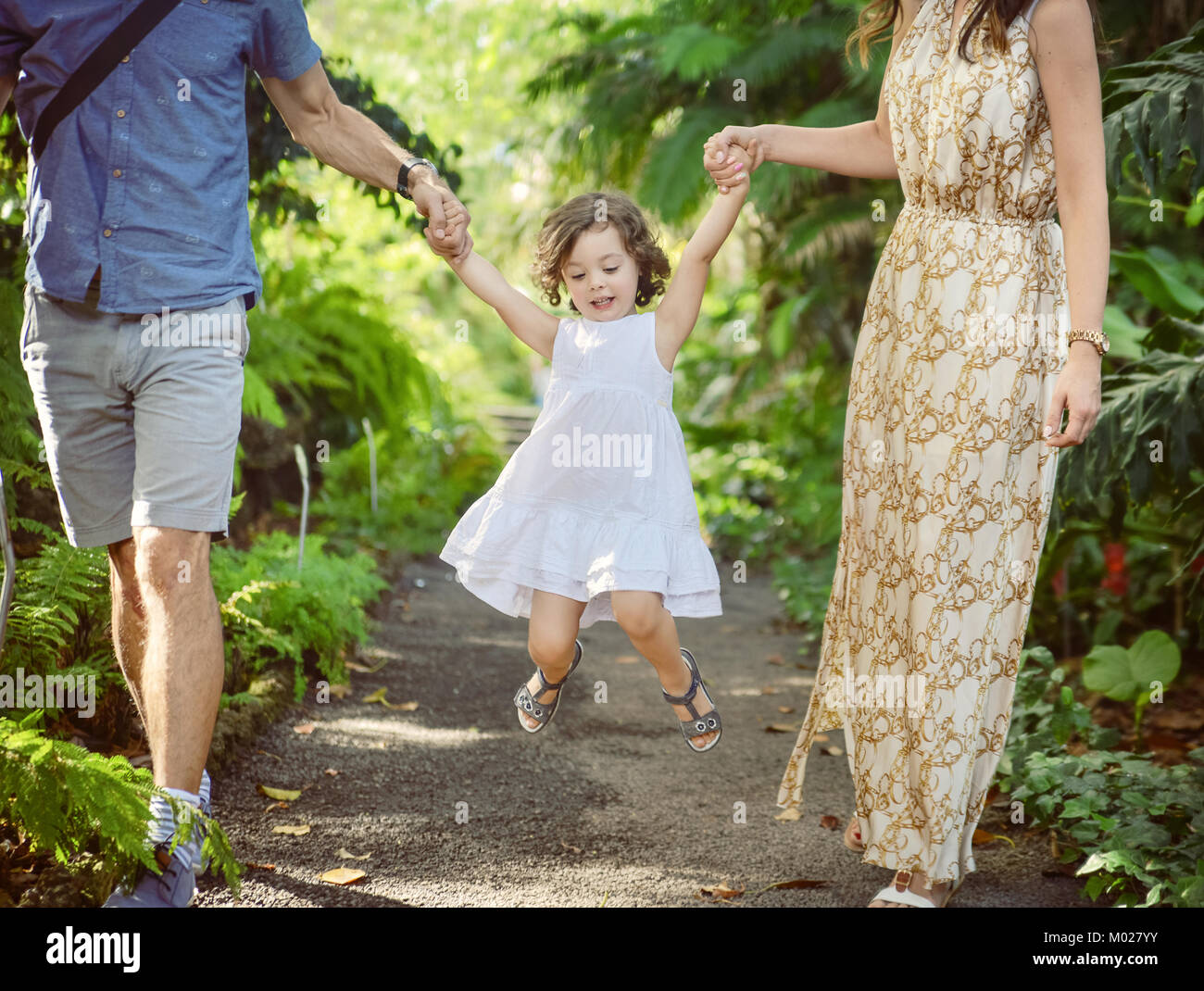 Cheerful parents having fun on vacation with their child Stock Photo ...