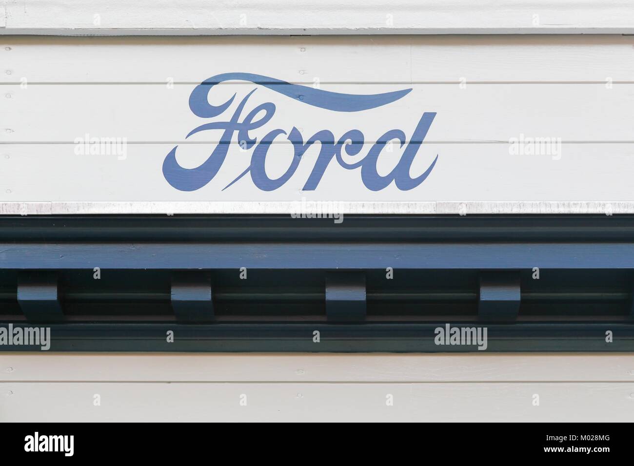 Aarhus, Denmark - August 28, 2017: Vintage Ford logo on a wall. Ford is ...