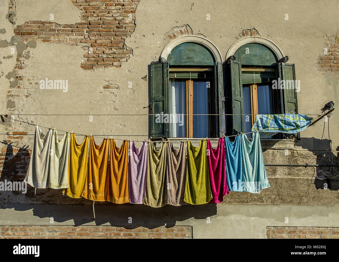 A rainbow of colourful laundry on a washing line, Venice Italy Stock ...