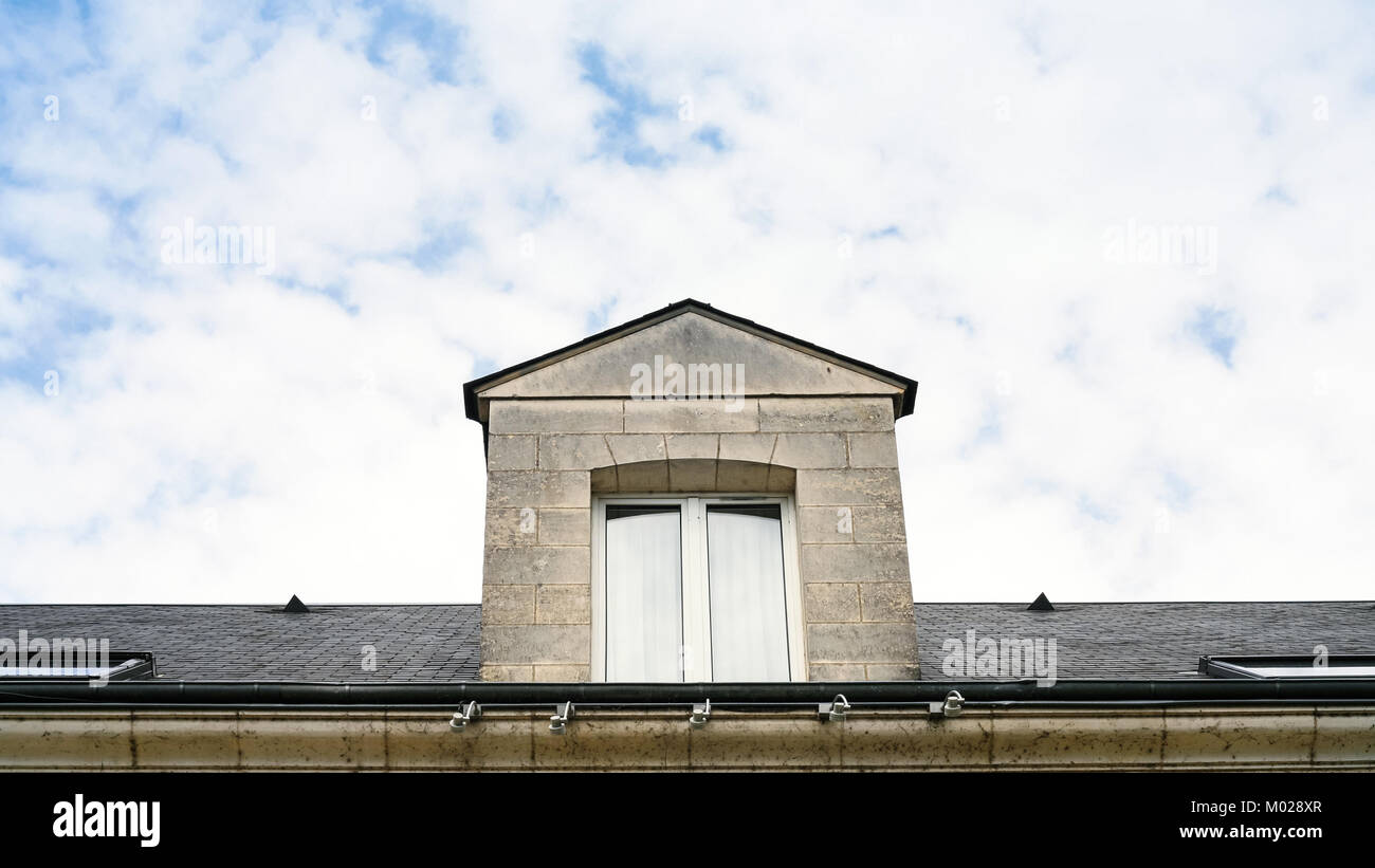 travel to France - window in attic on roof of house in Orleans city ...