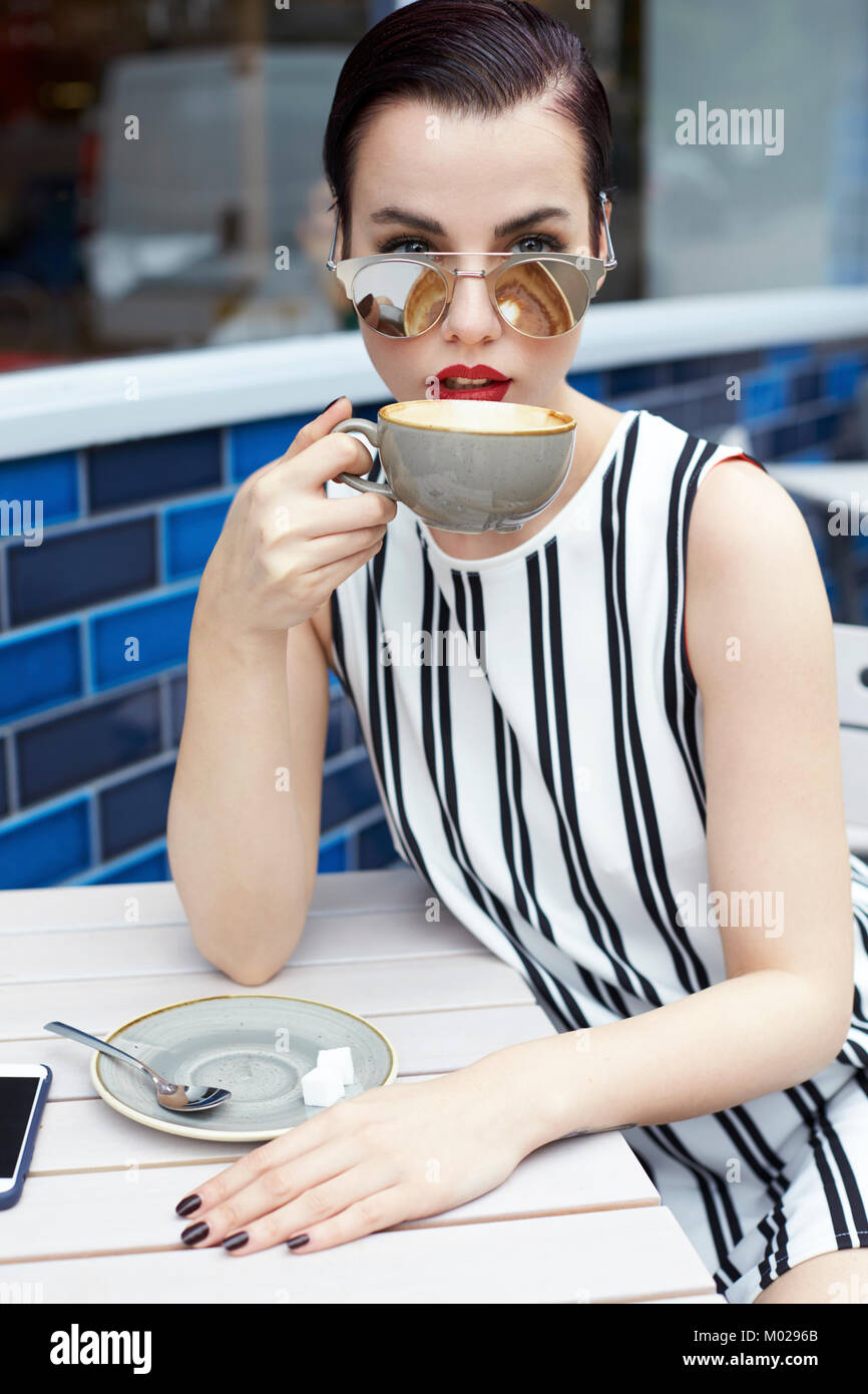 Woman relaxing in striped hi-res stock photography and images - Alamy