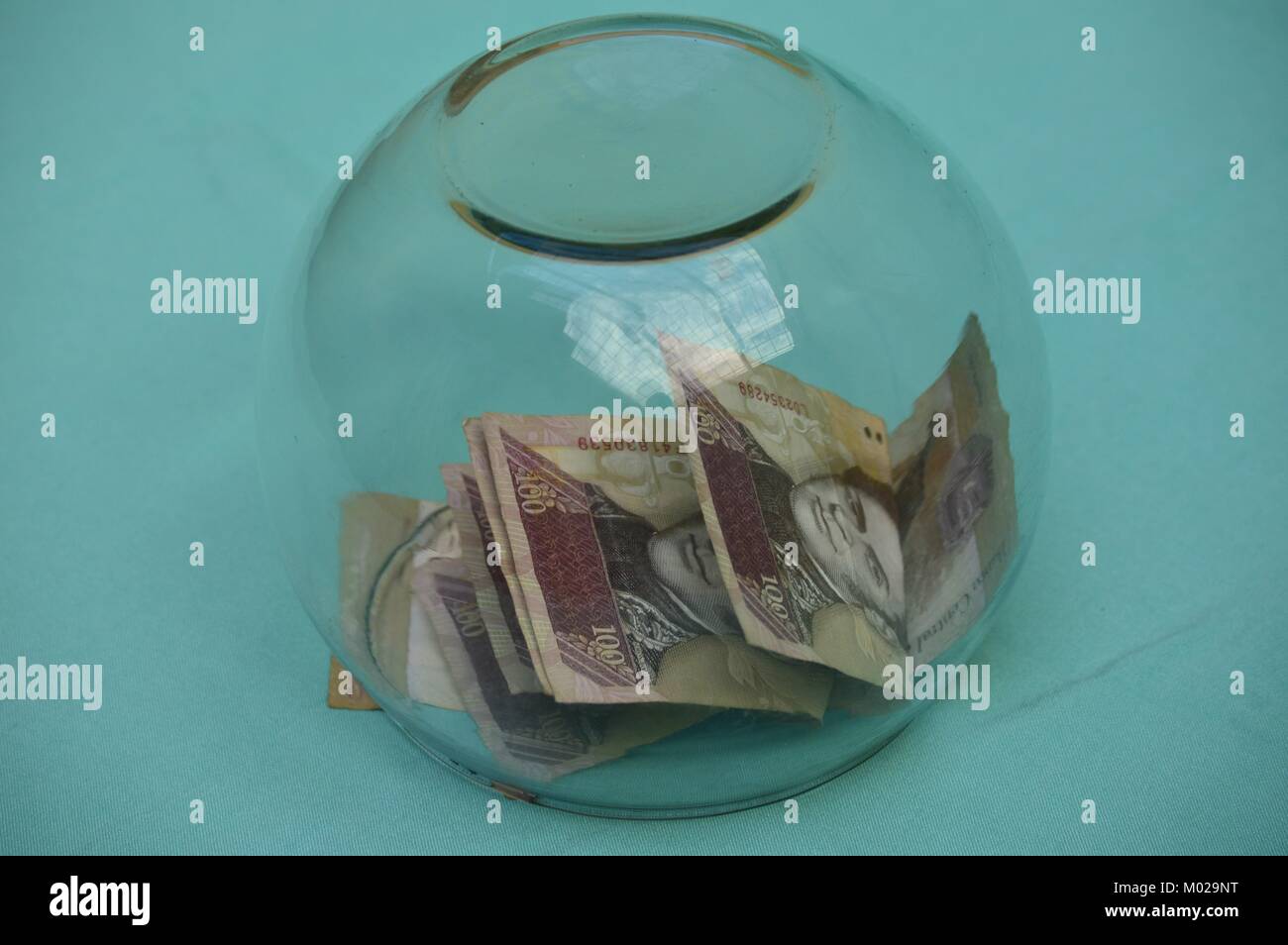 Banknotes trapped, concept of economic difficulties Stock Photo - Alamy