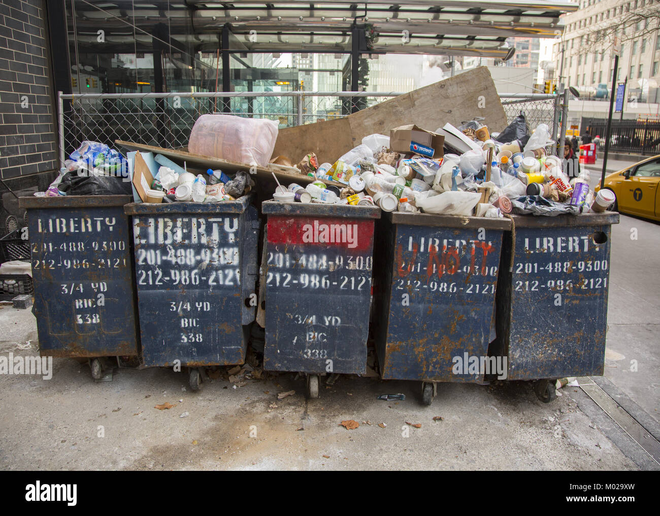 Overflowing garbage cans hi-res stock photography and images - Alamy