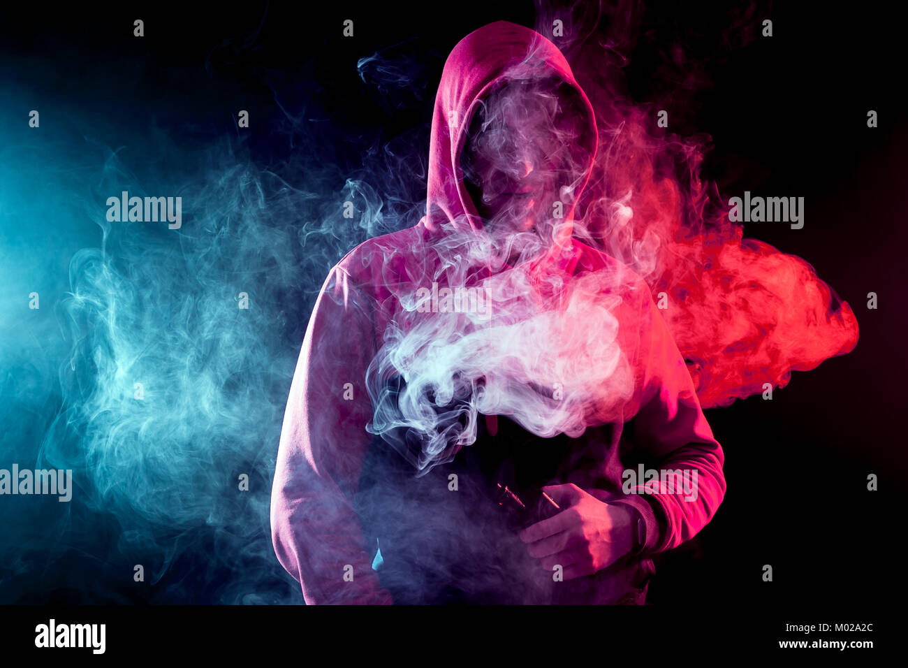 Man vaping an electronic cigarette.Isolated on black background Stock ...
