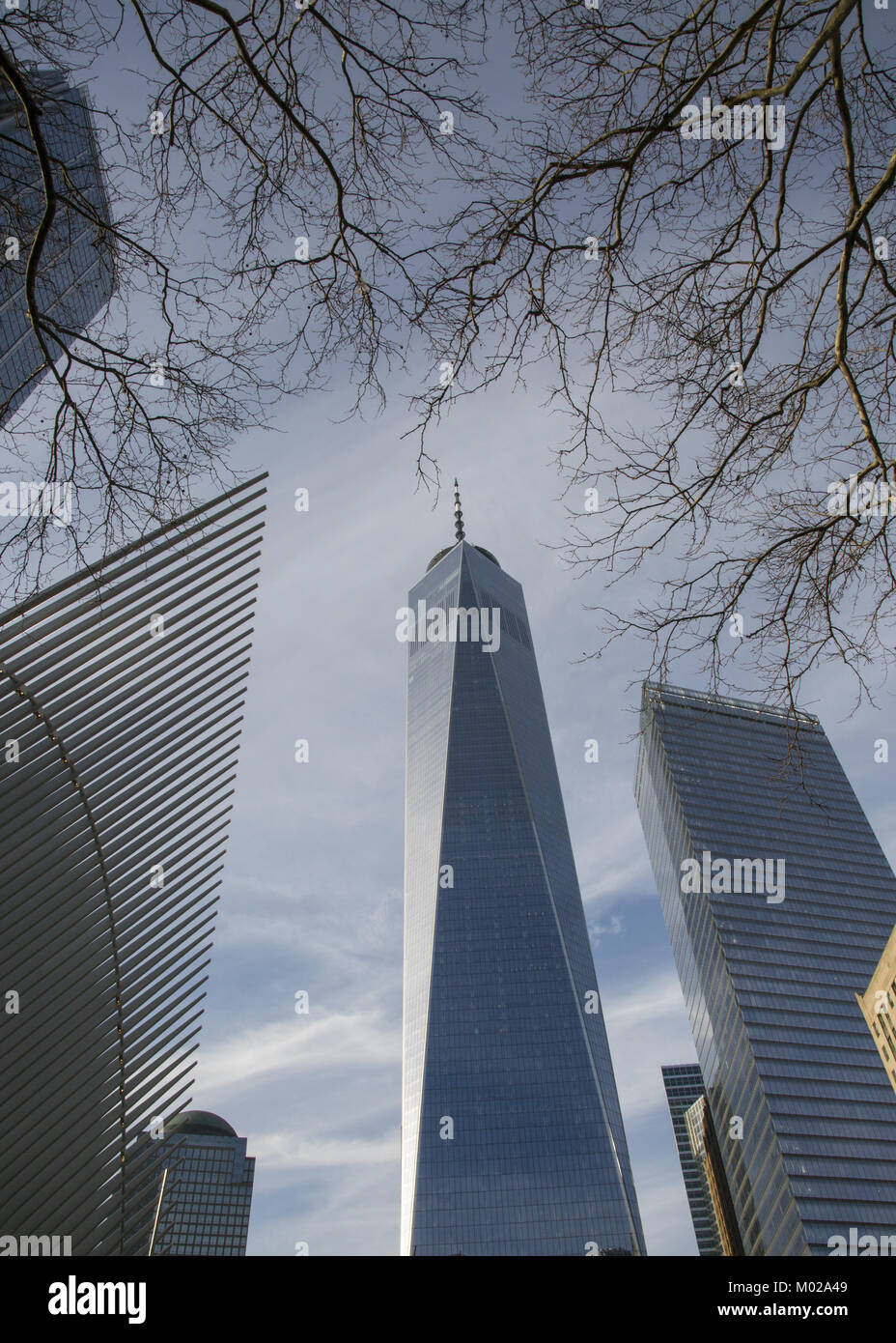 Looking up at the new 1 World Trade Center with a wing of the Oculus ...