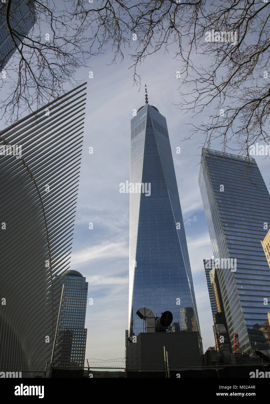 Looking up at the new 1 World Trade Center with a wing of the Oculus ...