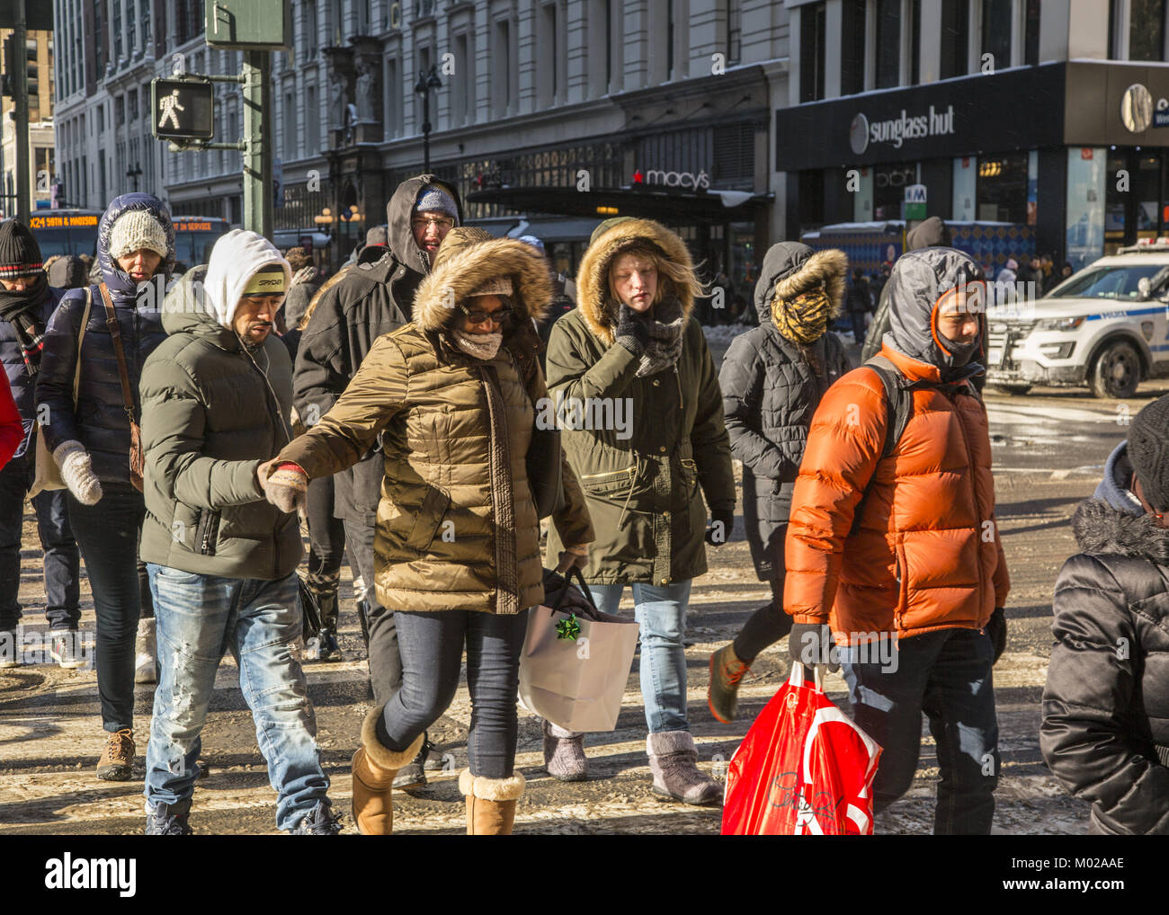 People bundled up on a cold winter day in midtown Manhattan. 34th ...