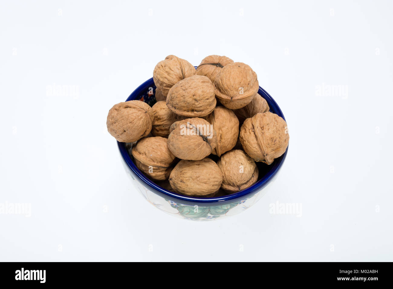 walnuts heap isolated on white background Stock Photo - Alamy