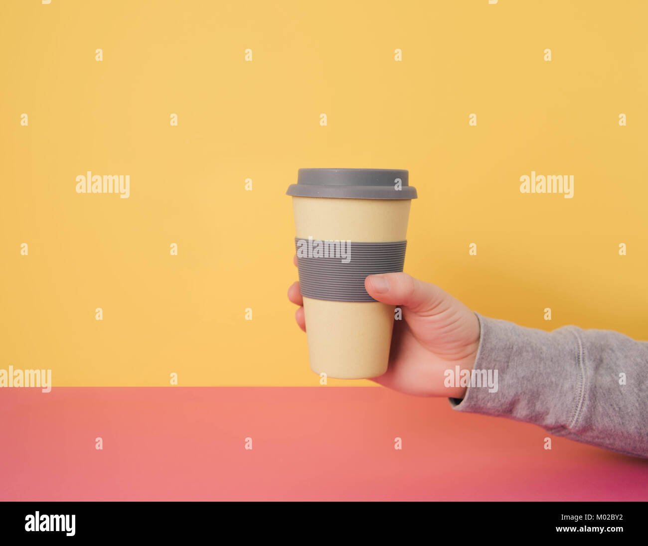 Hand holding take away coffee cup Stock Photo - Alamy