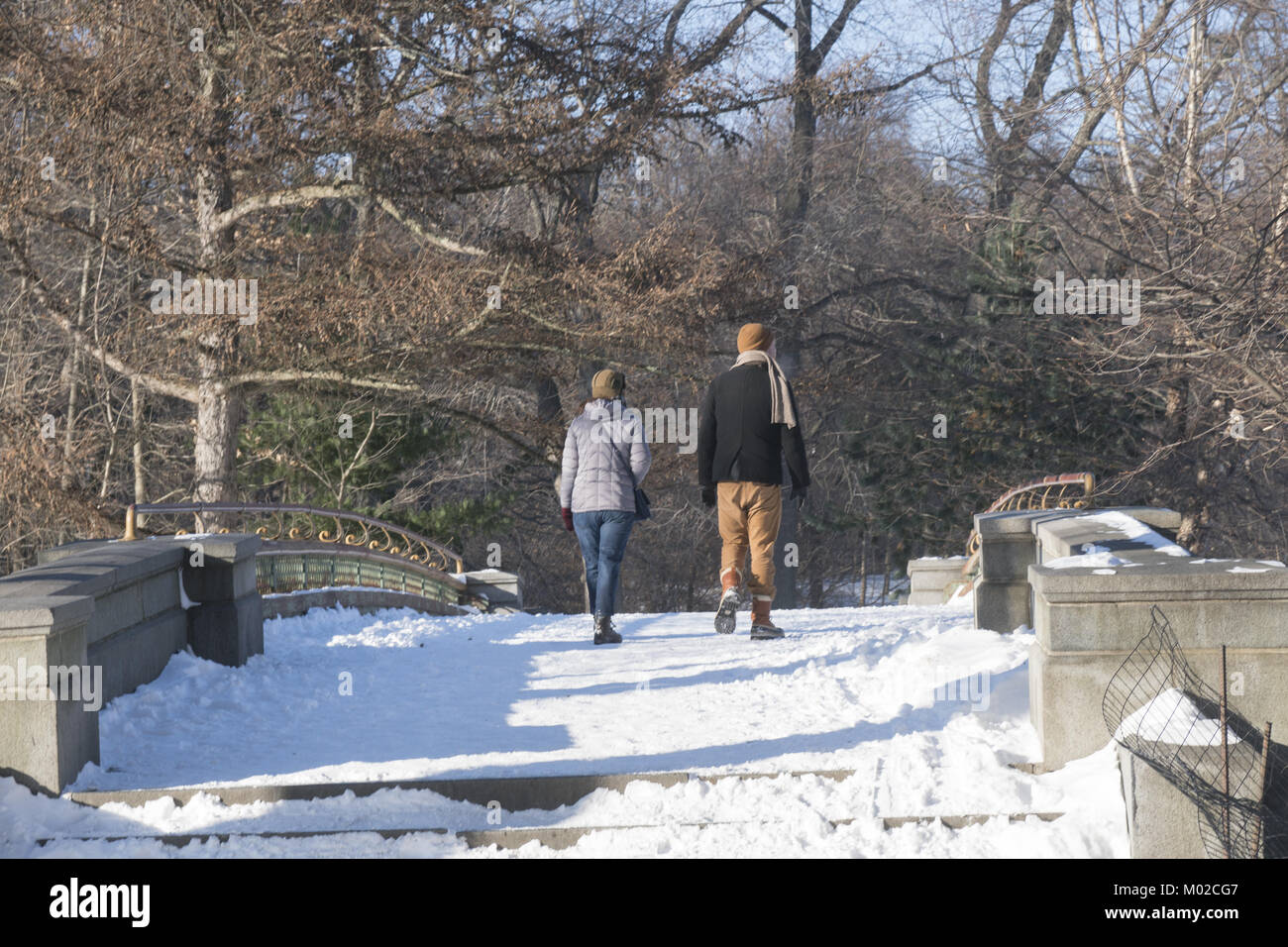 Couple walks over the Lullwater Bridge near the Boathouse in Prospect ...