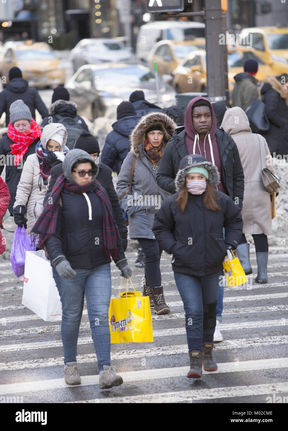 People bundled up on a cold winter day in midtown Manhattan Stock Photo ...