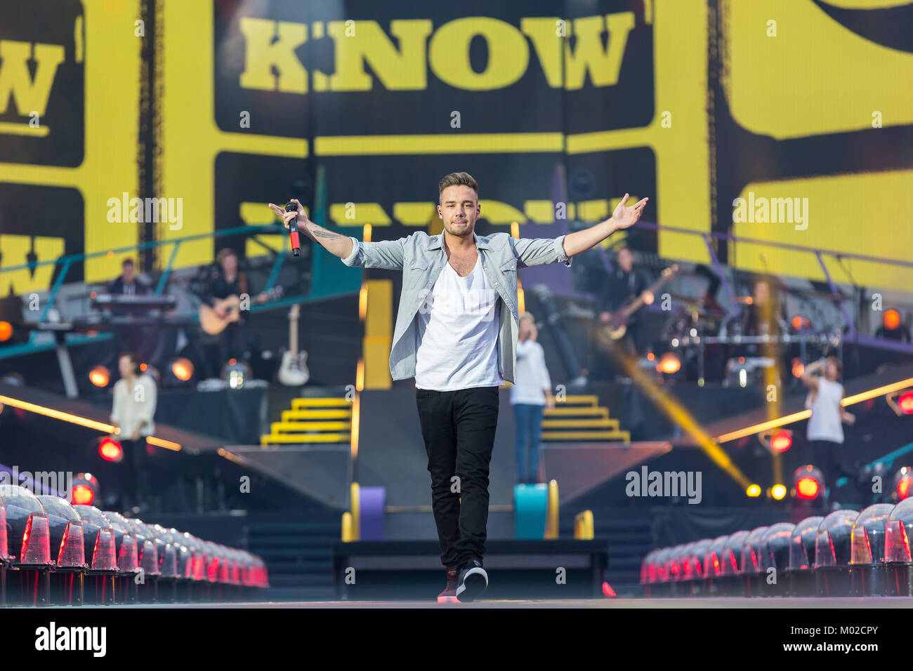 The popular English-Irish pop and boy band One Direction performs a ...