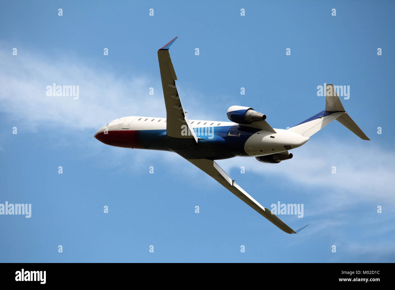 business jet in the blue sky Stock Photo - Alamy