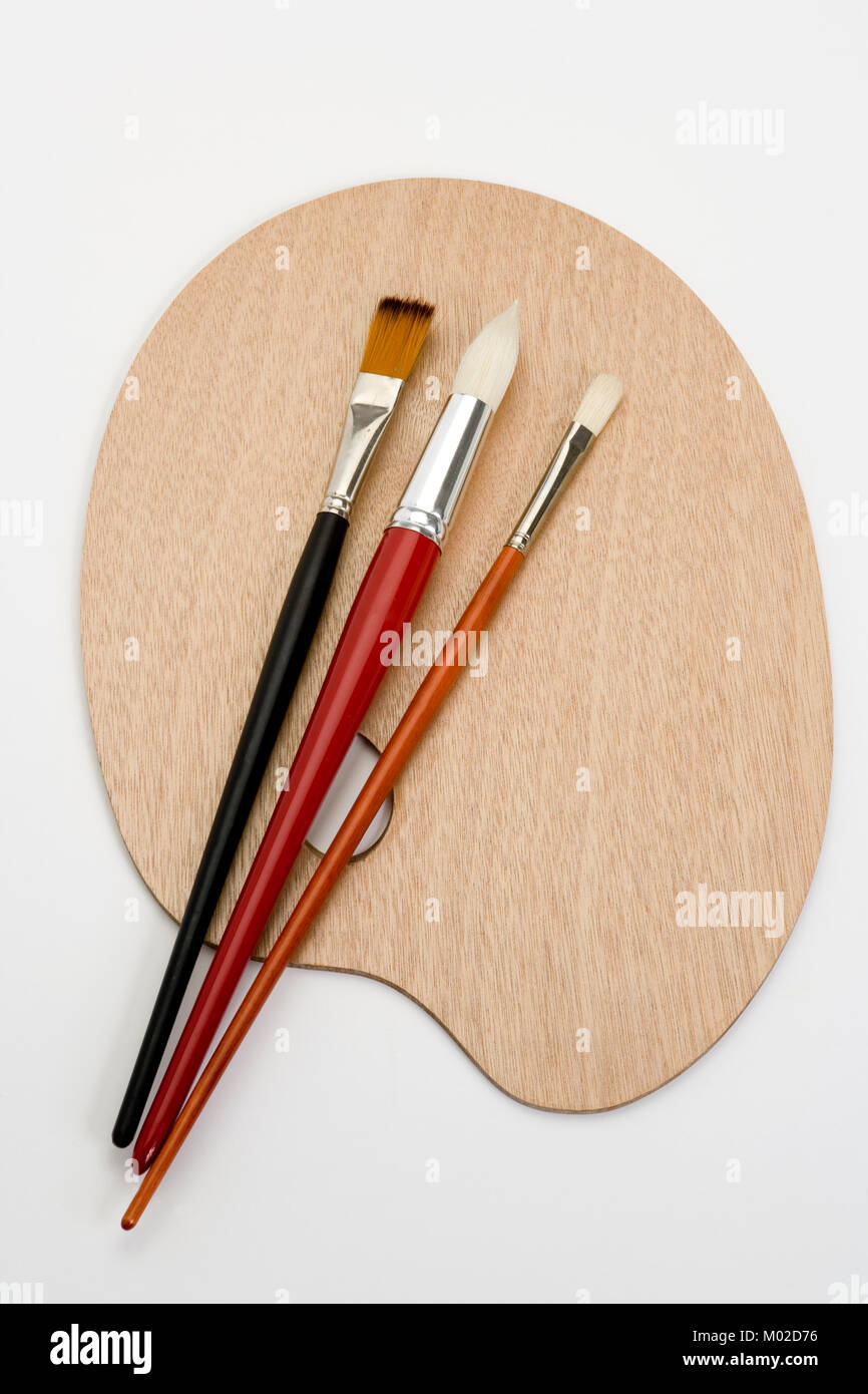 Brand new art palette and brushes on a white background Stock Photo - Alamy