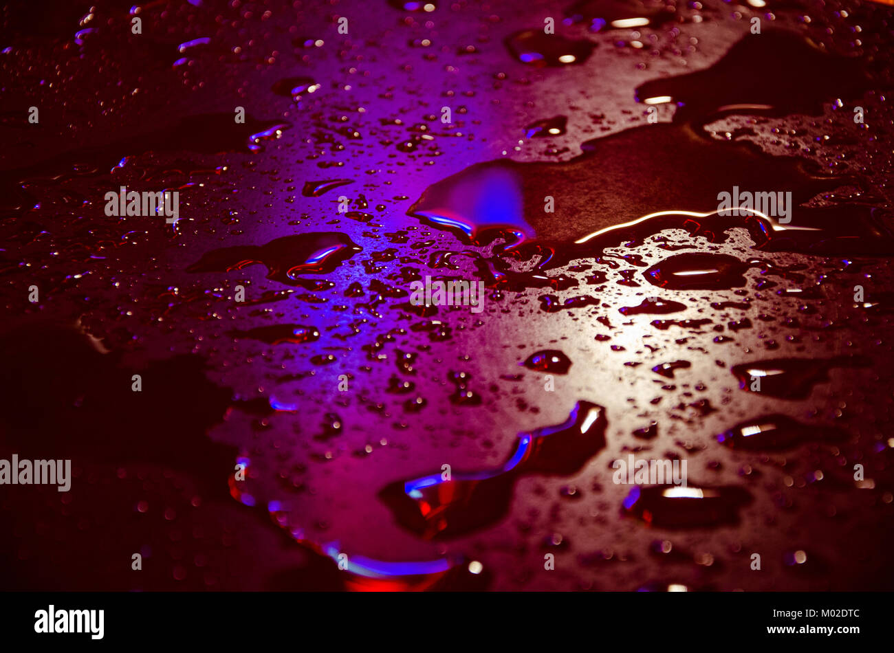 Red surface after the rain Stock Photo - Alamy