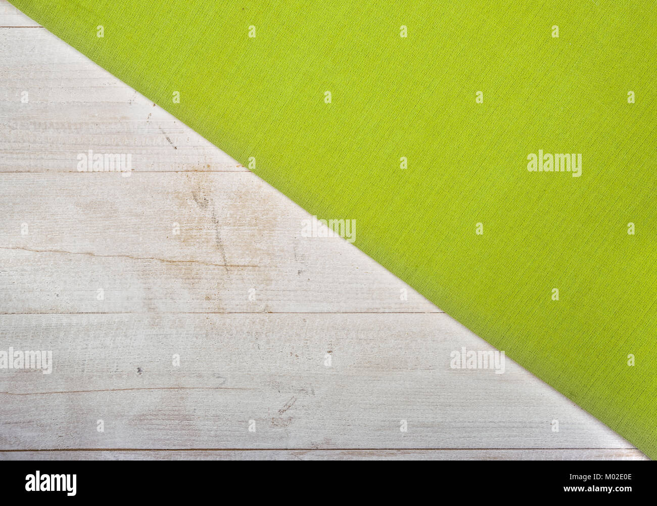 Green kitchen cloth on wood table Stock Photo - Alamy