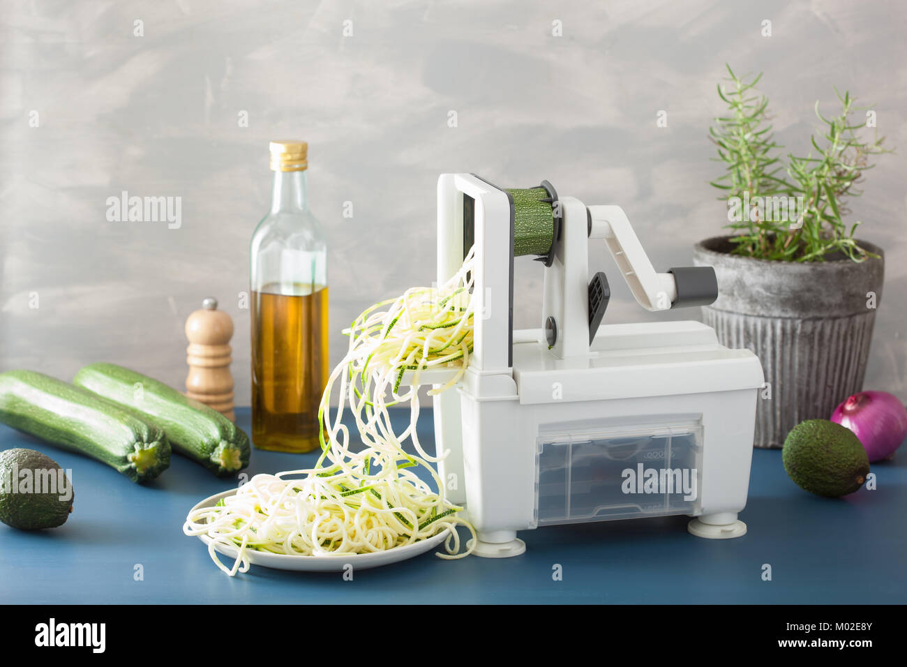 spiralizing courgette raw vegetable with spiralizer Stock Photo - Alamy