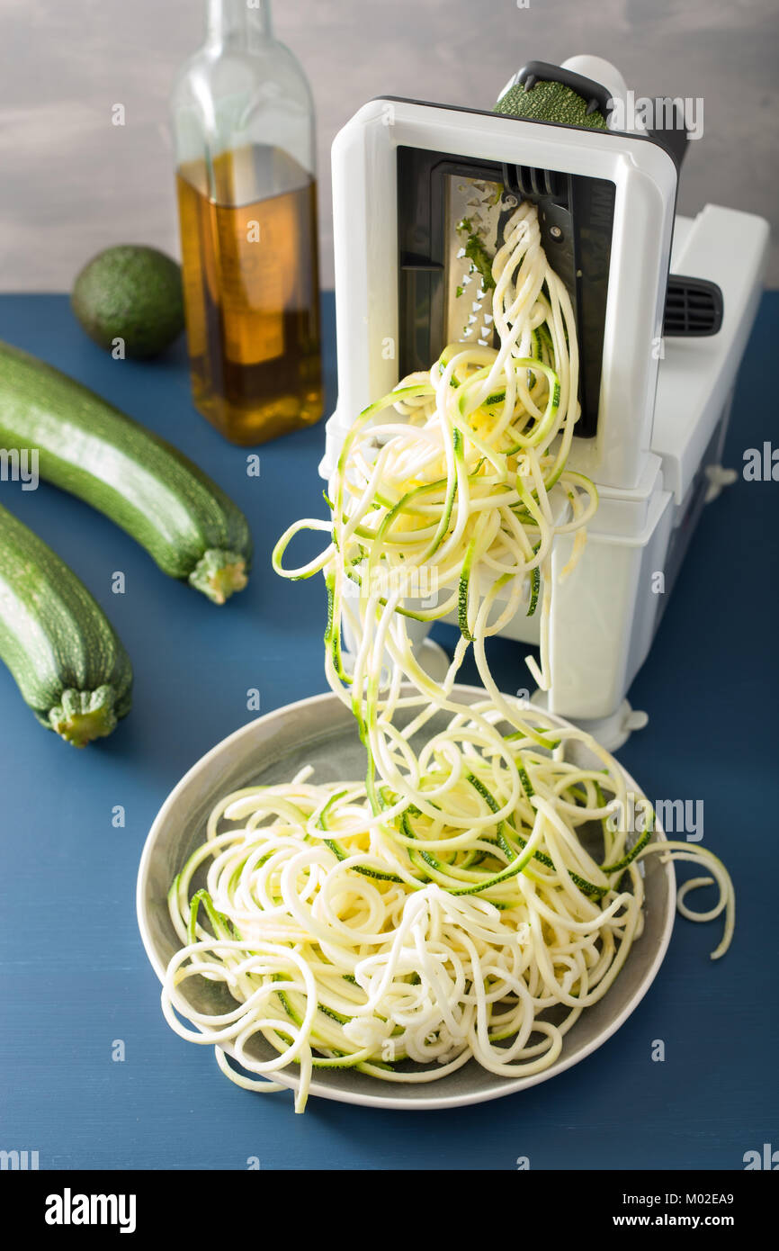 spiralizing courgette raw vegetable with spiralizer Stock Photo - Alamy