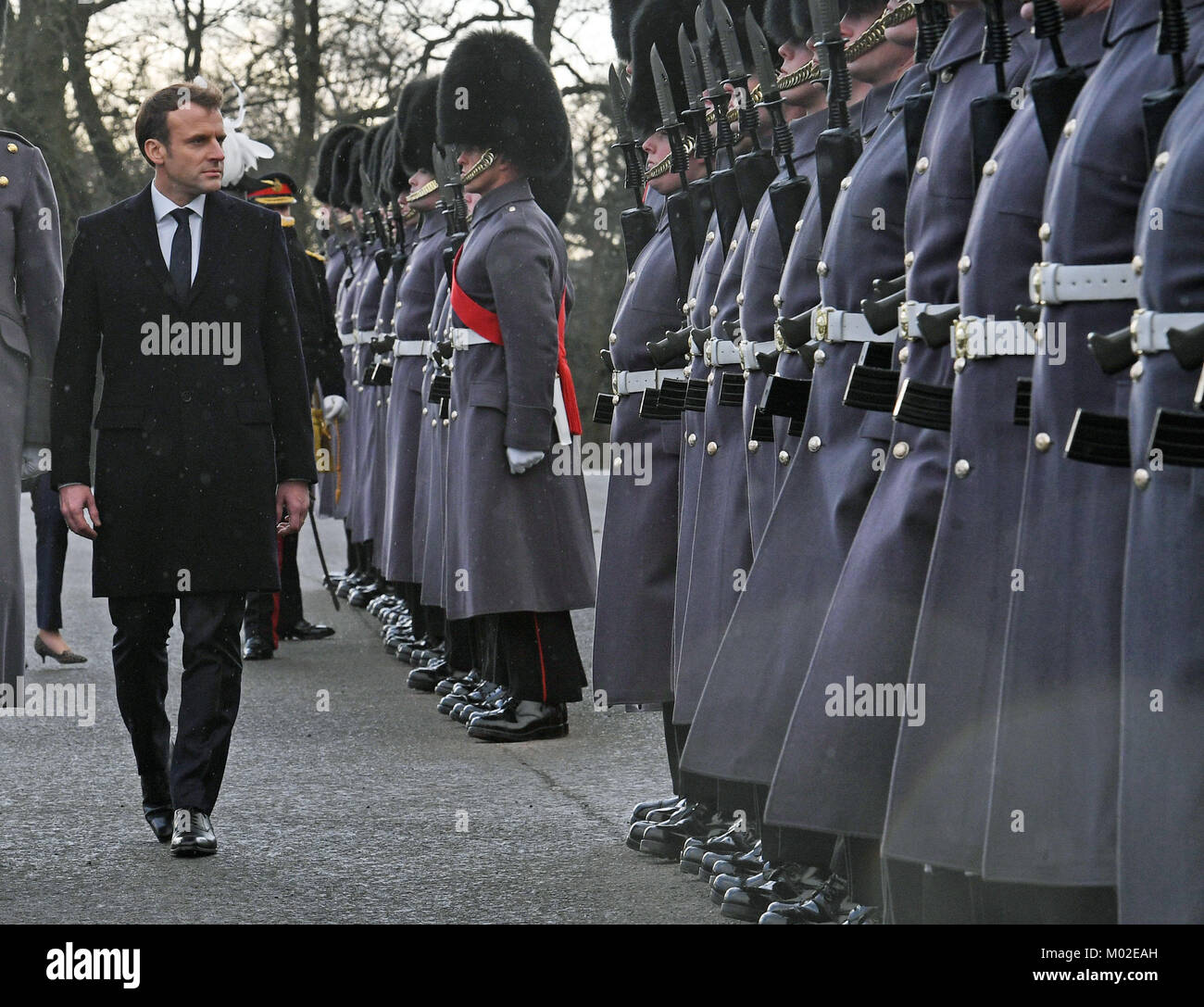 French President Emmanuel Macron views a guard of honour at the Royal ...