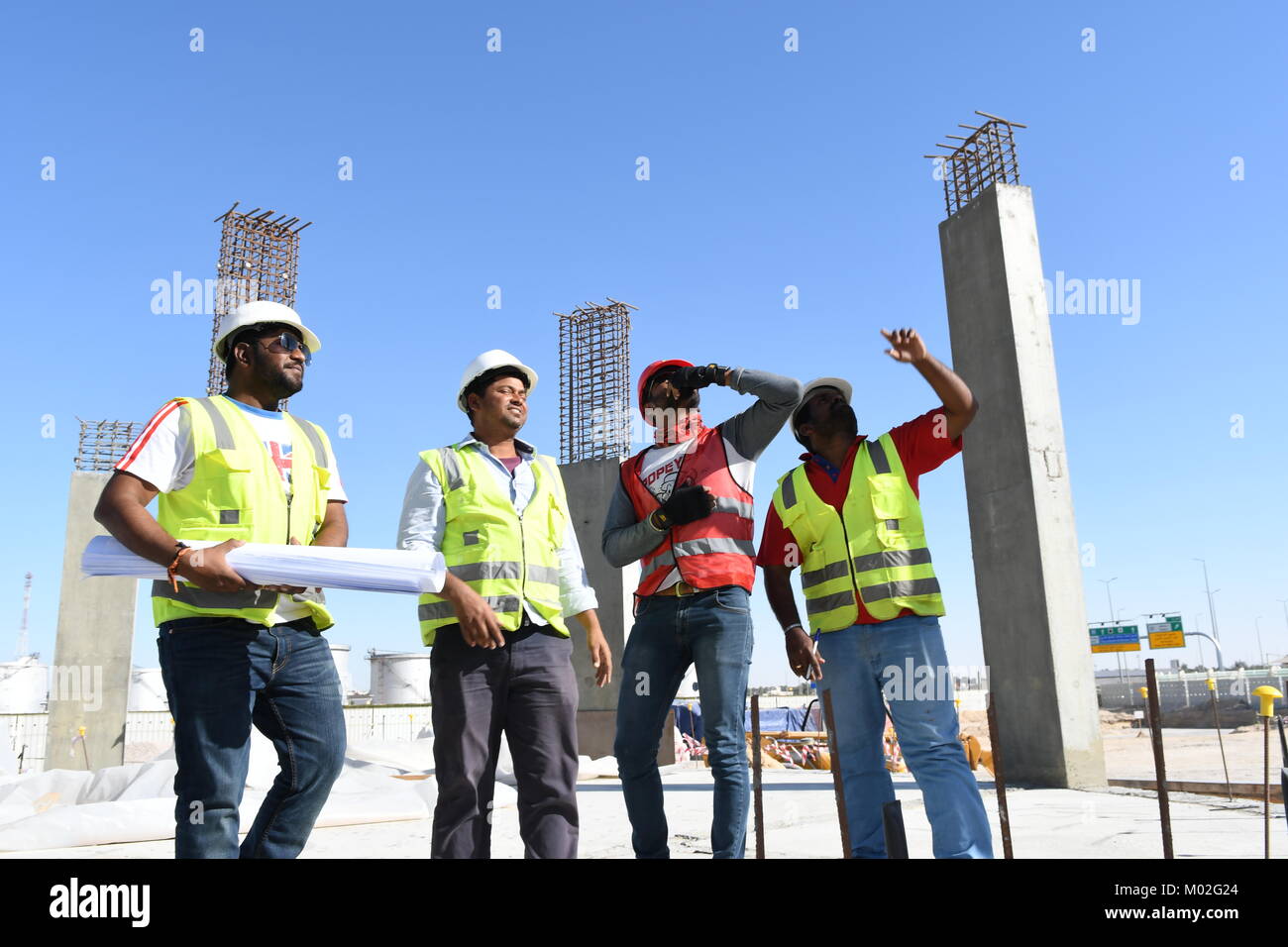 Indian Civil Engineers and foremen are working on the construction site ...