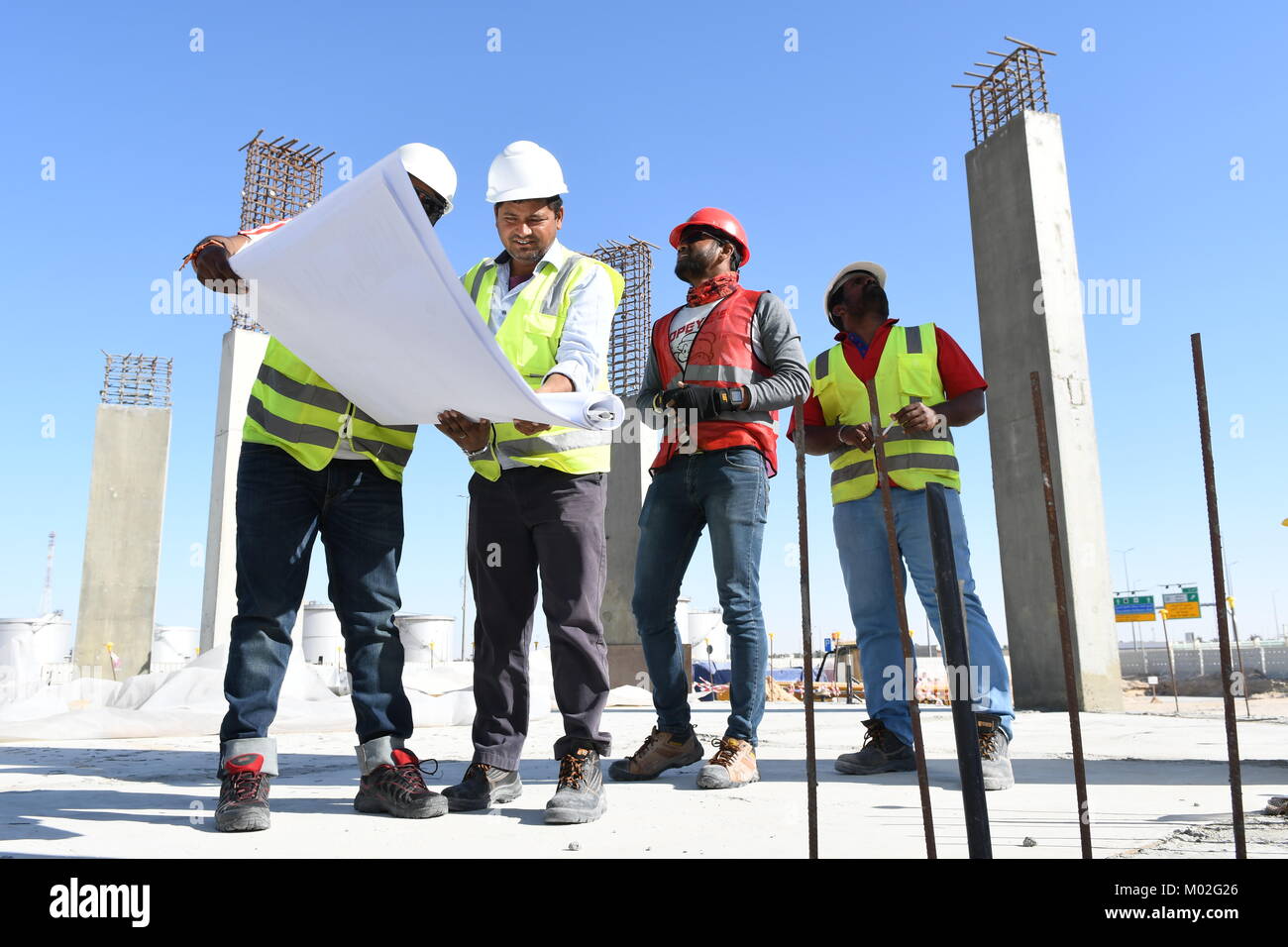 Indian Civil Engineers and foremen are working on the construction site ...