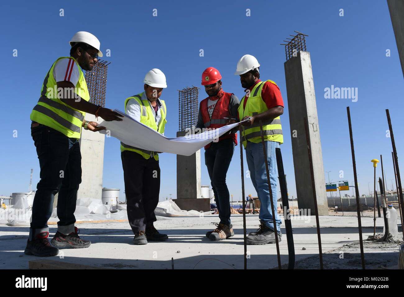 Indian Civil Engineers and foremen are working on the construction site ...