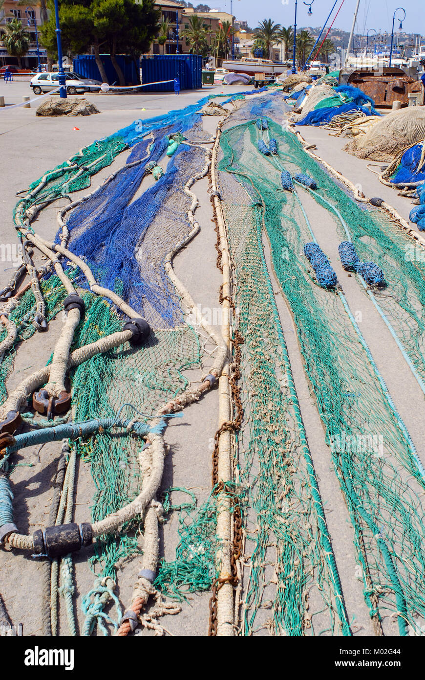 fishing nets laid out in a harbor Stock Photo - Alamy