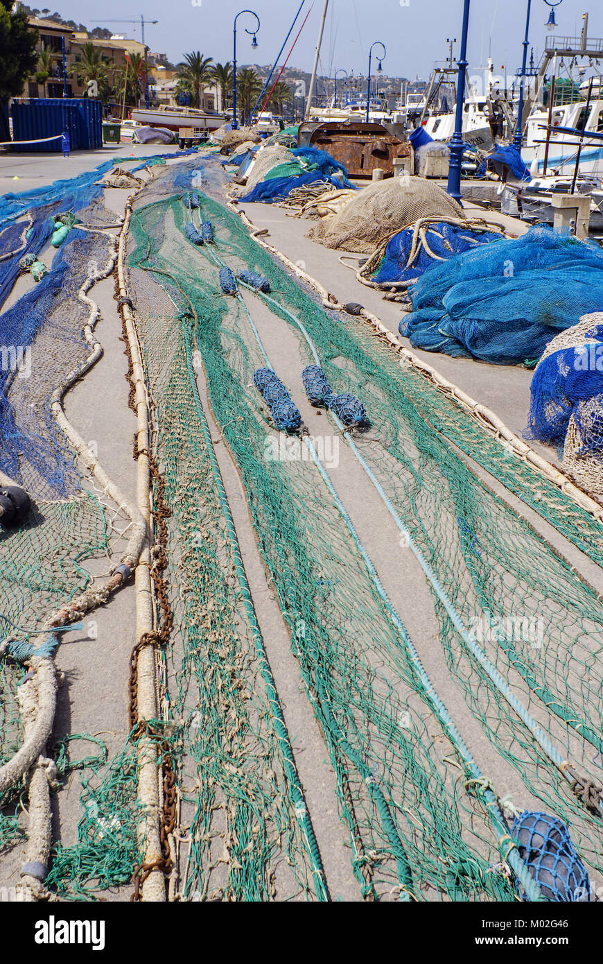 fishing nets laid out in a harbor Stock Photo - Alamy