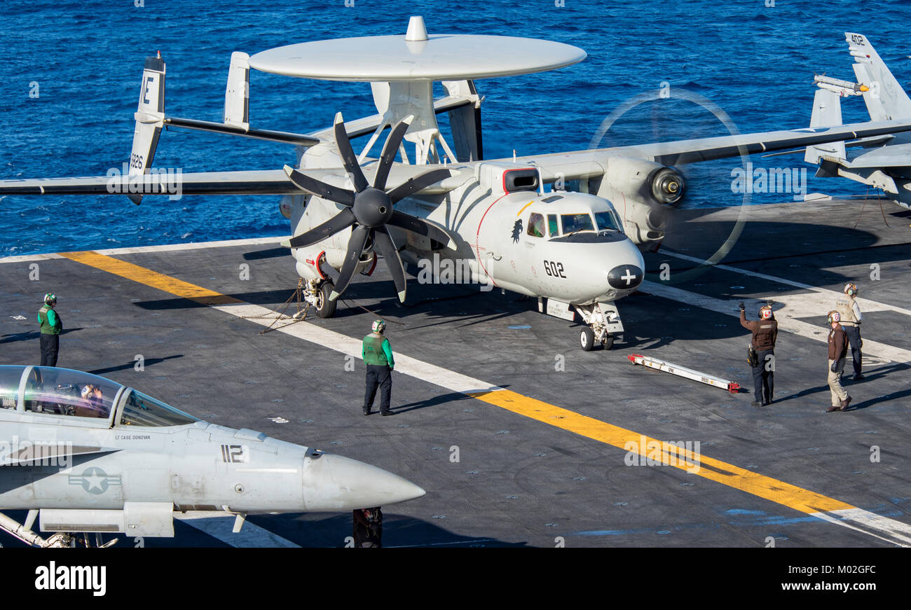 Sailors prepare an E-2C Hawkeye assigned to the “Black Eagles” of ...