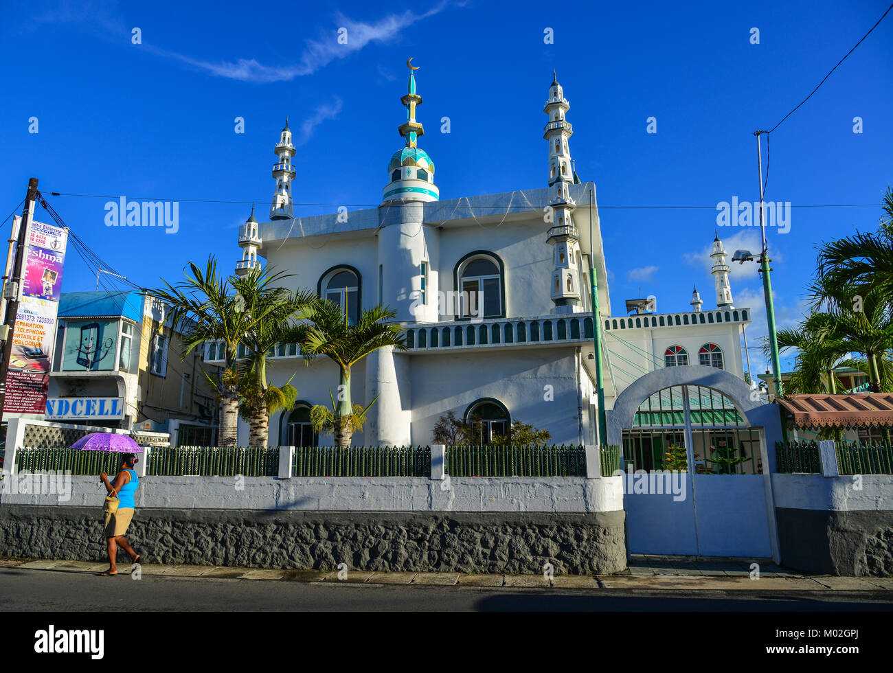 Mahebourg, Mauritius - Jan 9, 2017. A woman walking on street in ...