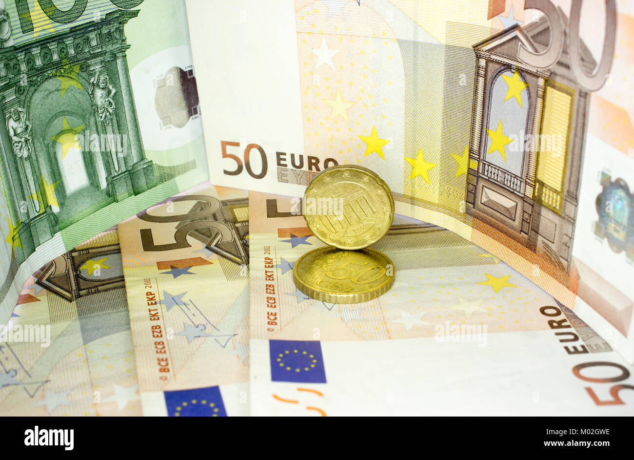 European coins on the various Euro banknotes like background Stock ...