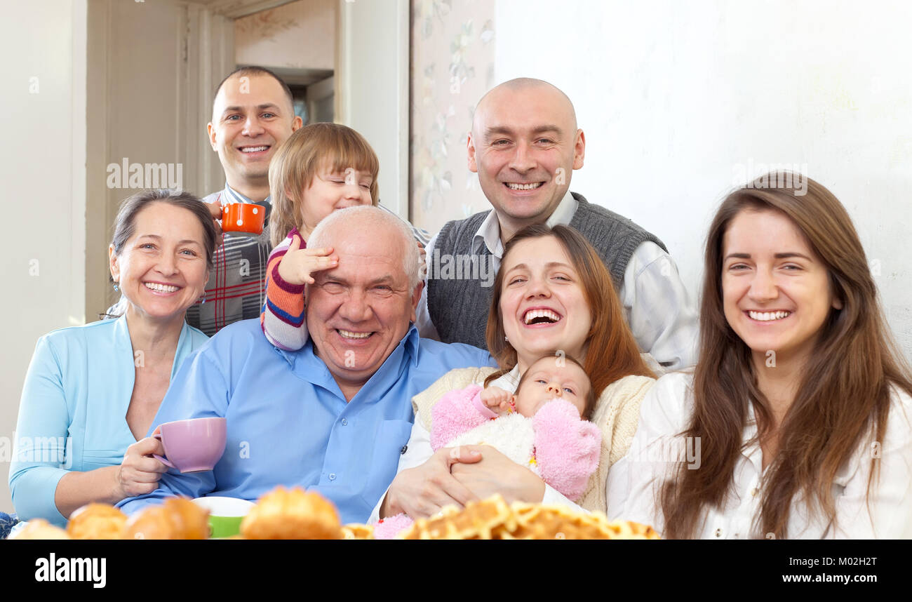 happy multigeneration family with little children at home Stock Photo ...
