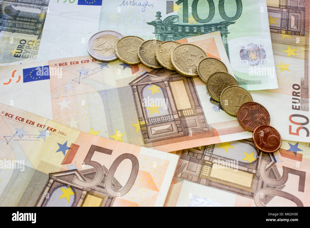 European coins on the various Euro banknotes like background Stock ...