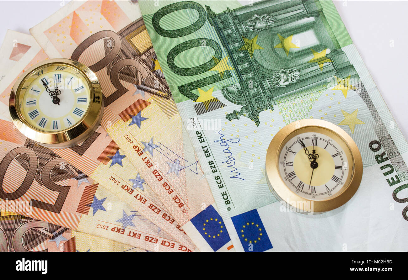 European banknotes like background and two clocks that have five to ...