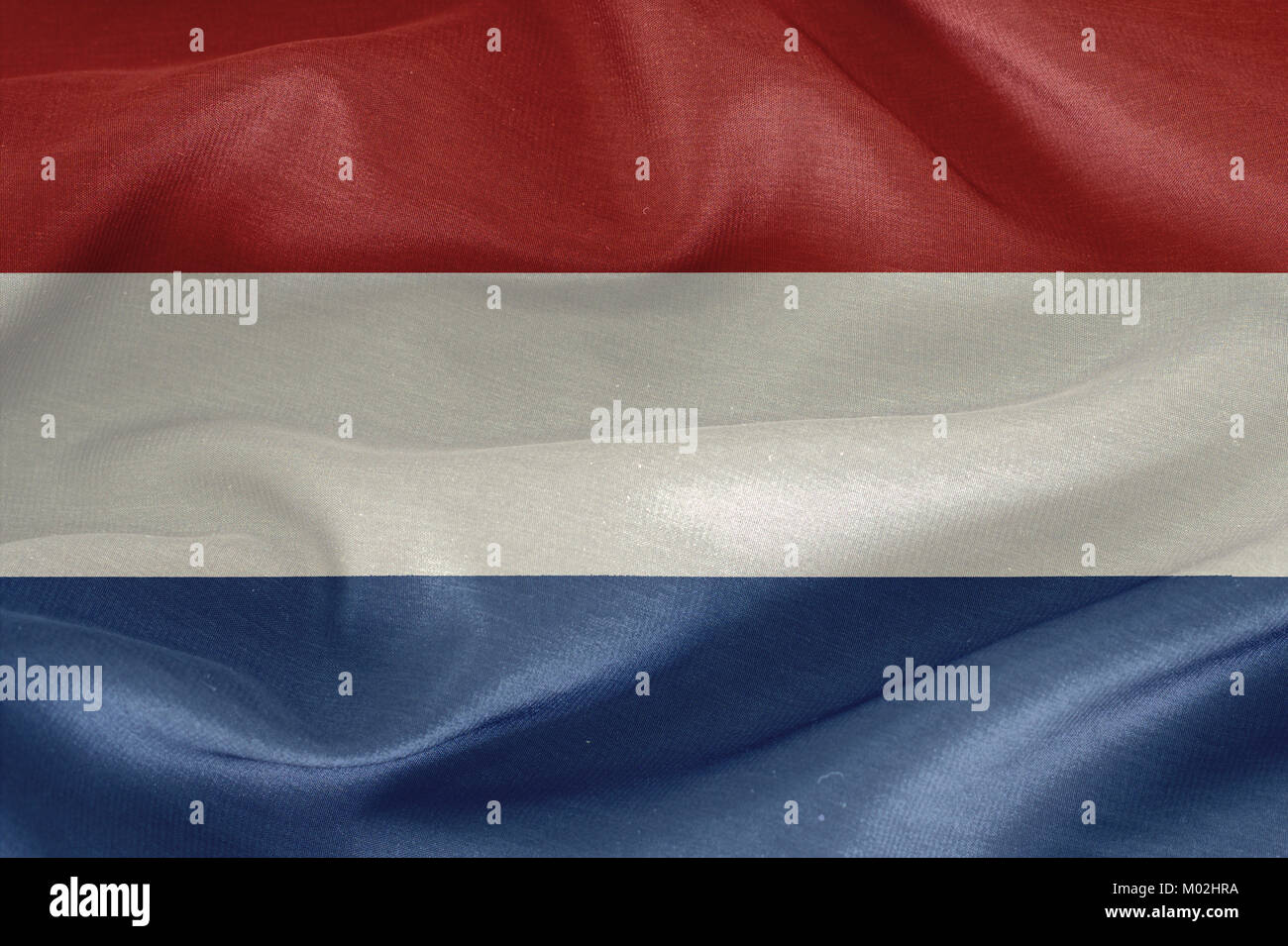 Netherlands flag pattern on the fabric texture Stock Photo - Alamy