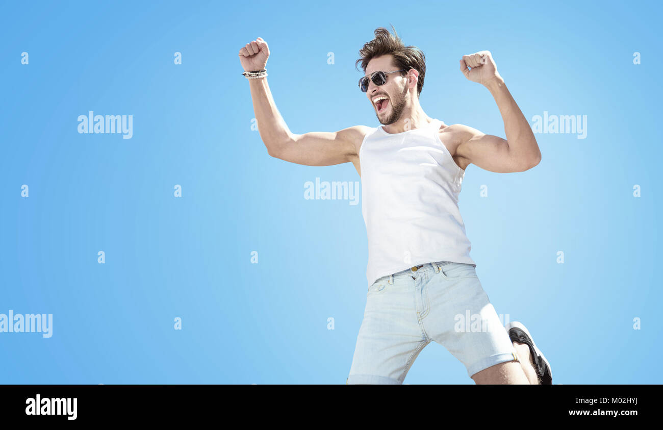 Handsome guy enjoying the summer in a tropical place Stock Photo - Alamy