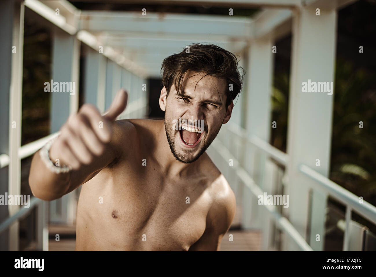 Handsome guy enjoying the summer in a tropical place Stock Photo - Alamy