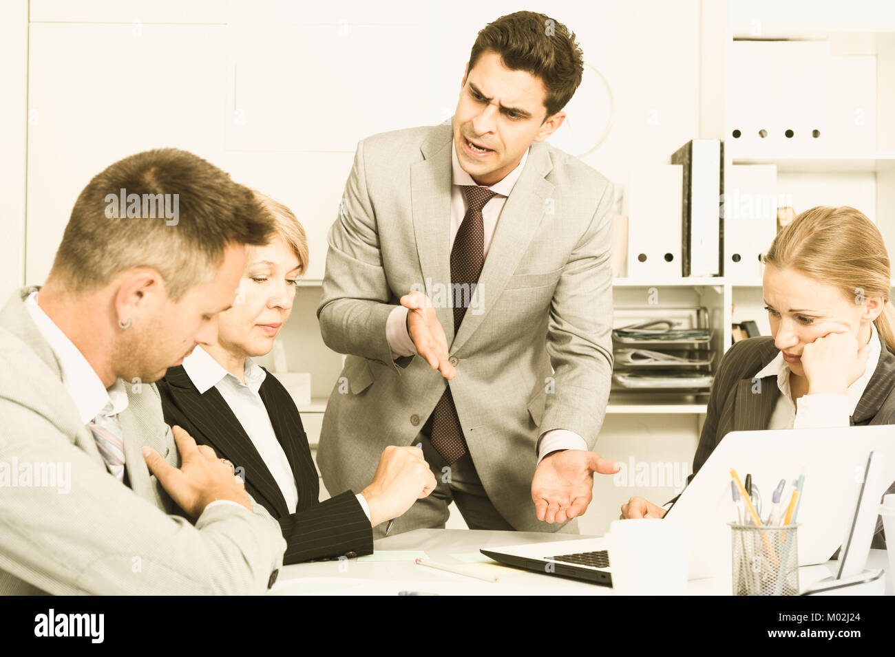 Businessman feeling angry to coworkers in office, pointing out mistakes ...