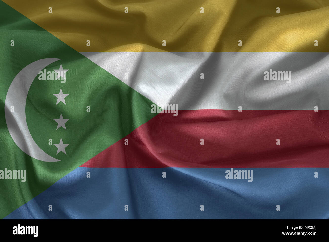 Comoros flag pattern on the fabric texture Stock Photo - Alamy