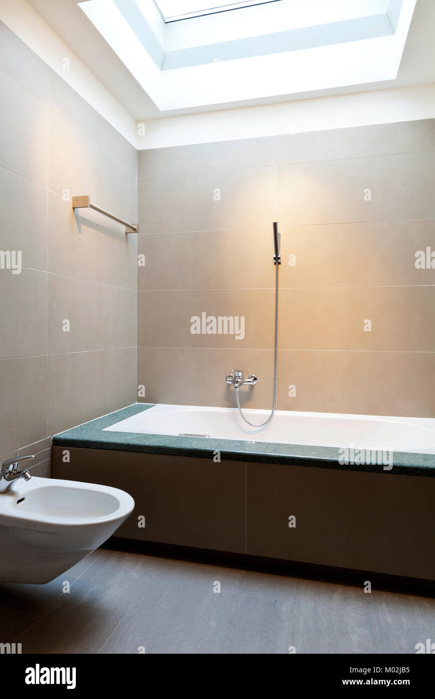 beautiful apartment, interior, bathroom clad in stone Stock Photo - Alamy