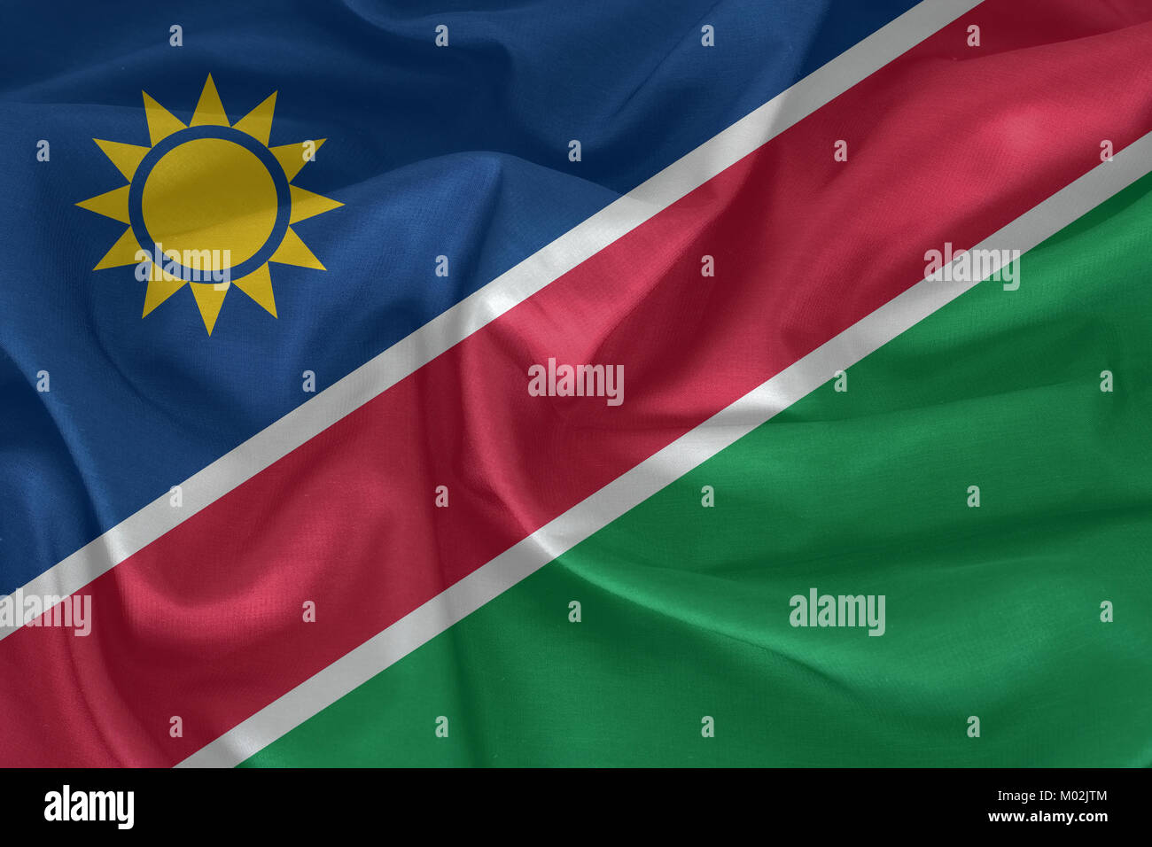 Namibia flag pattern on the fabric texture Stock Photo - Alamy
