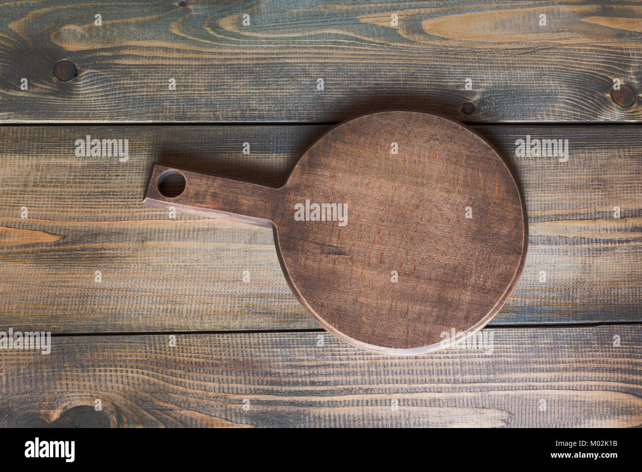 Rustic wooden cutting desk on wooden background. Top view Stock Photo ...