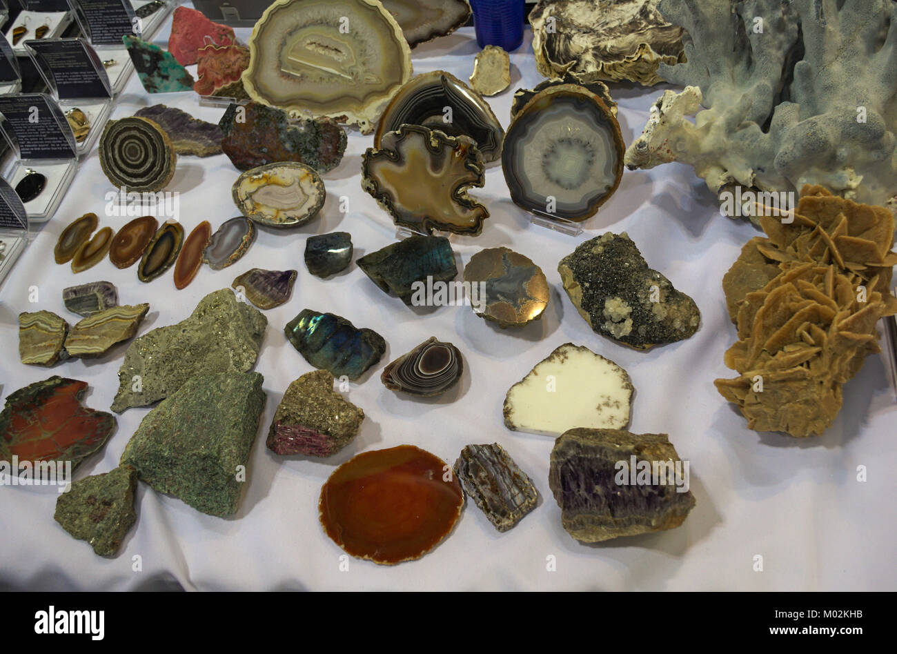 Lot of various different crystals displayed on table Stock Photo - Alamy