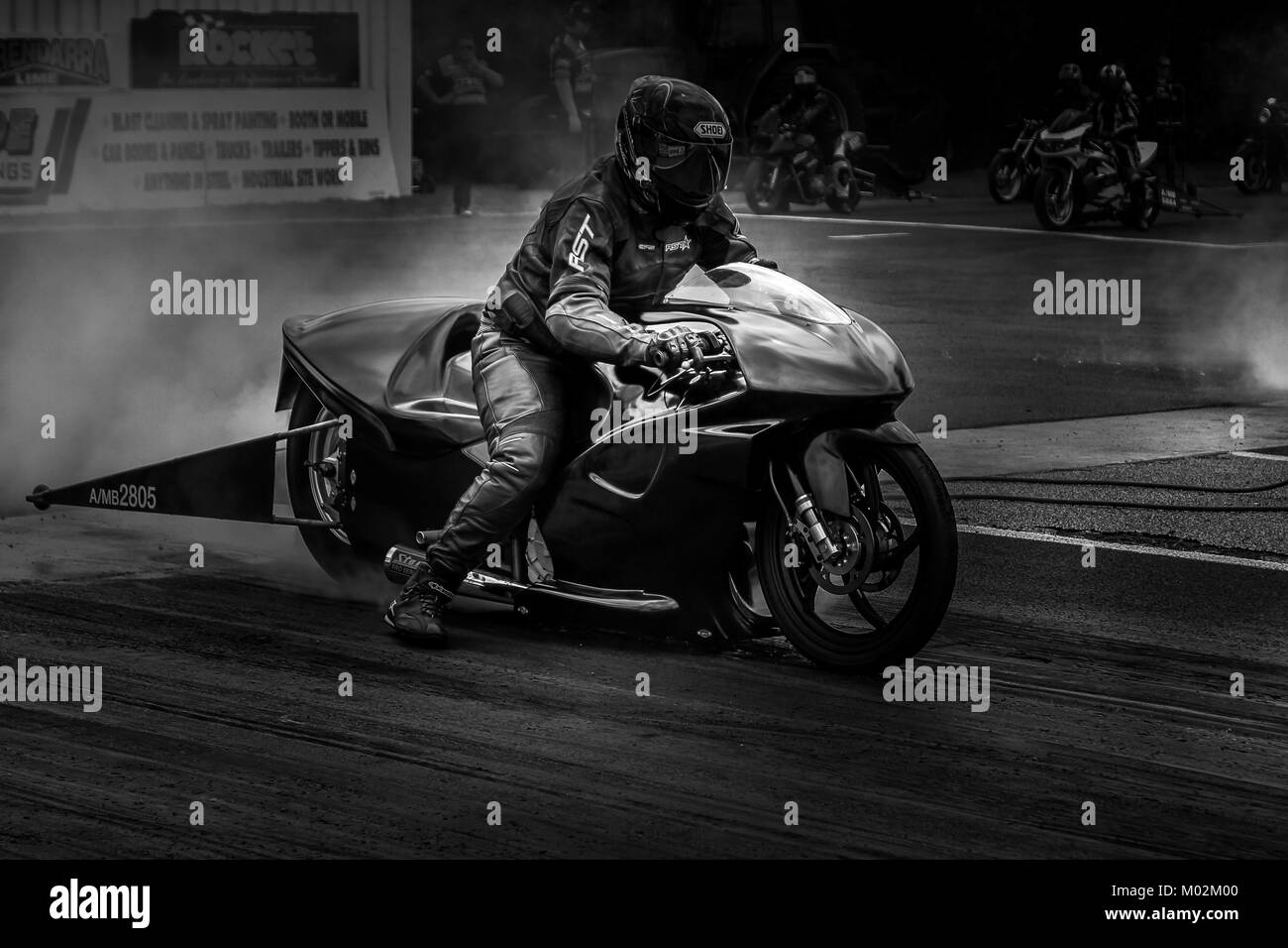 Tire smoke Black and White Stock Photos & Images - Alamy